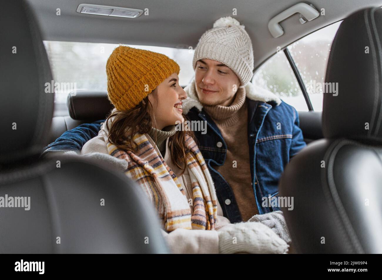 Couple hugging in back seat hi-res stock photography and images - Alamy