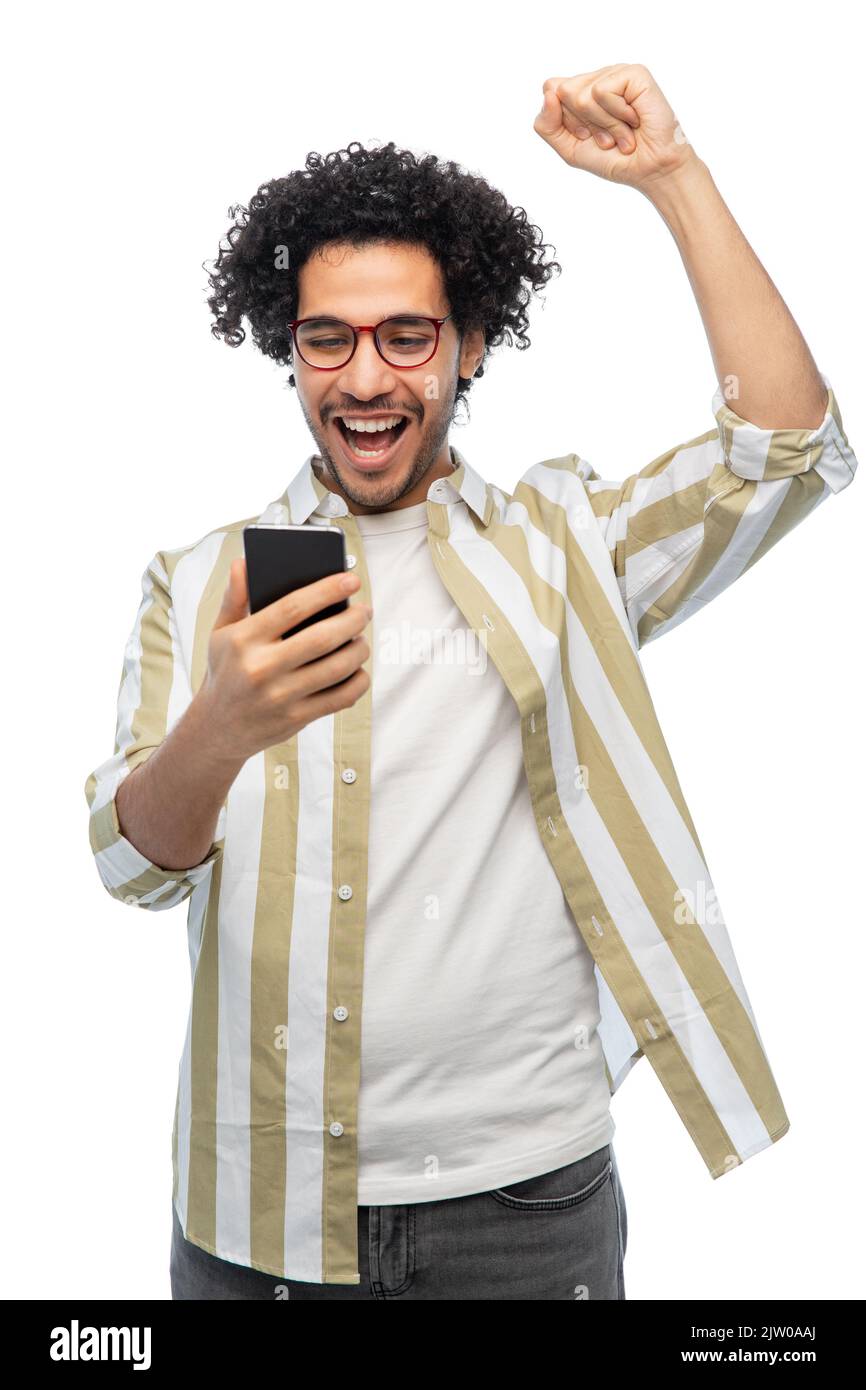 happy smiling young man with smartphone Stock Photo - Alamy