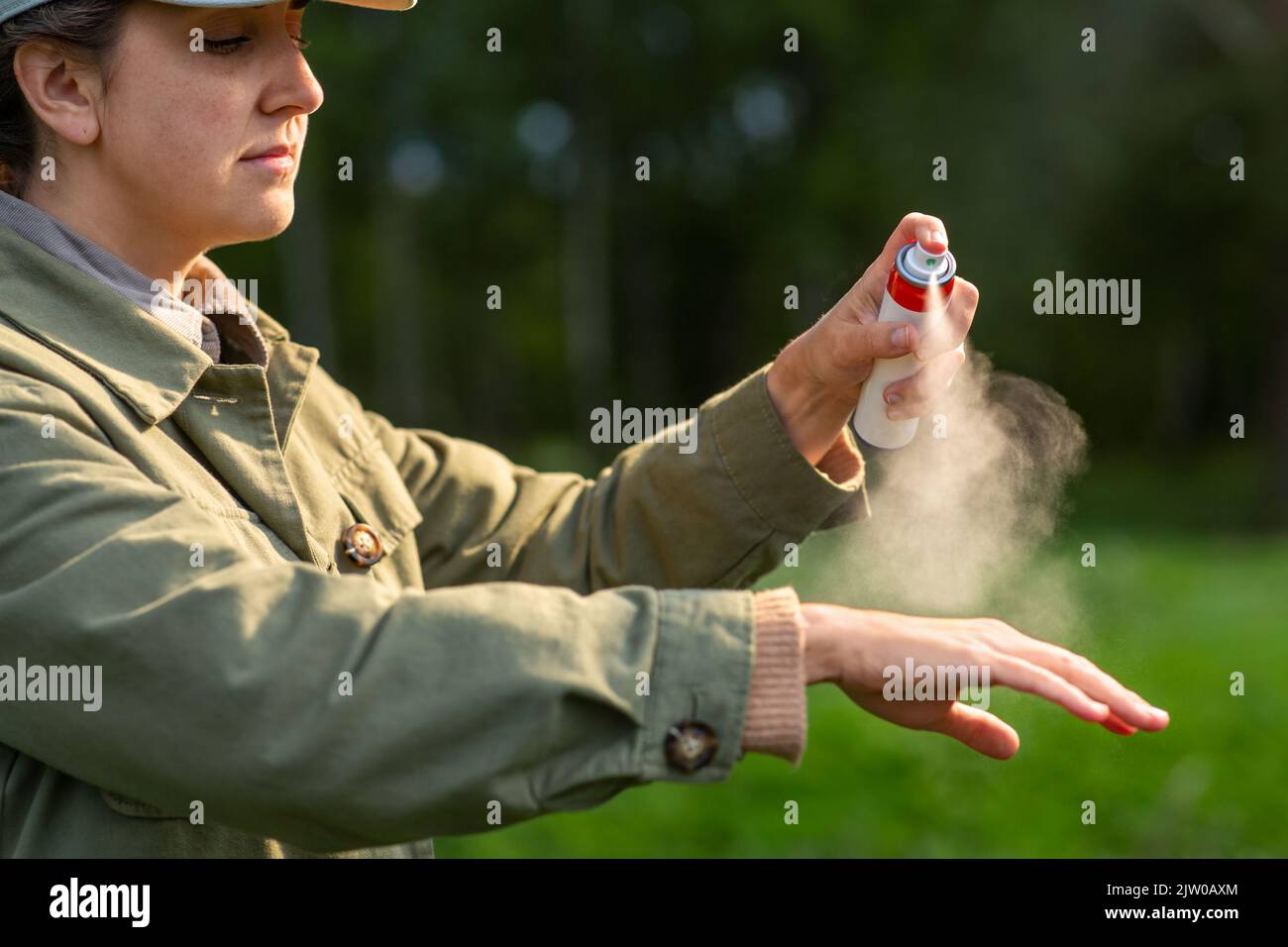Woman spraying repellent hi-res stock photography and images - Alamy