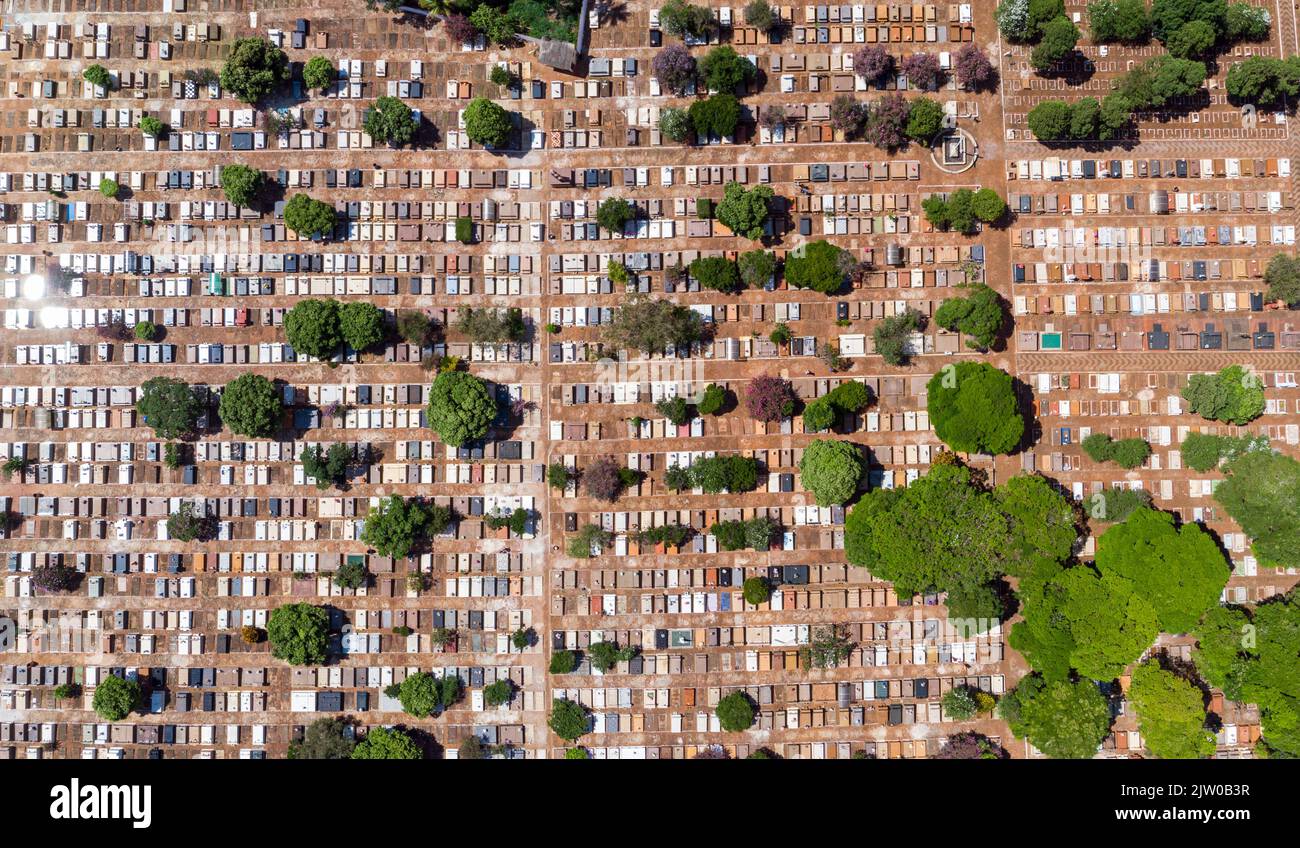 Scenic aerial flight directly above densely packed cemetery graveyard ...