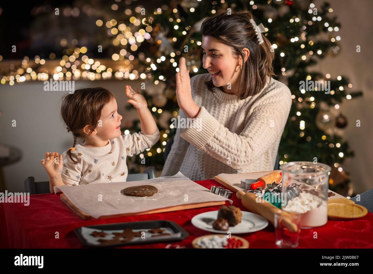 mother and daughter making gingerbread at home Stock Photo - Alamy