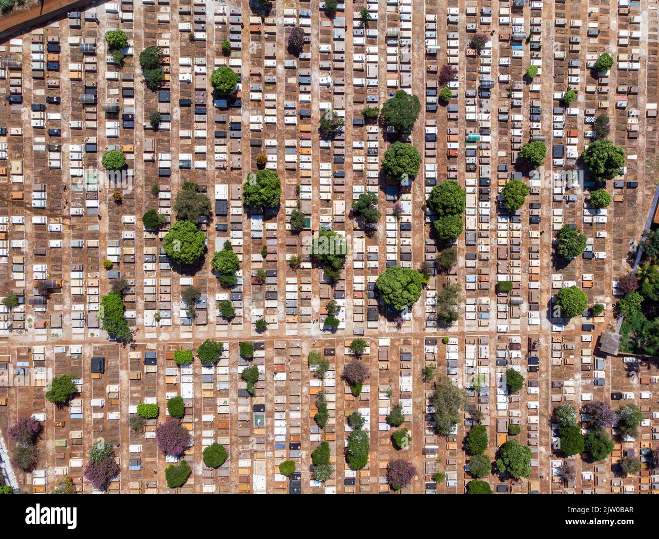 Scenic aerial flight directly above densely packed cemetery graveyard ...