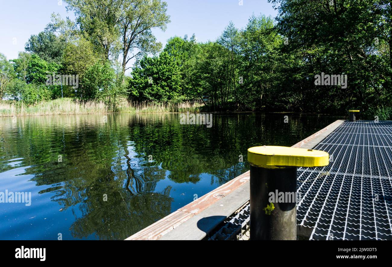 Elde river near the sluice in Barkow in Mecklenburg with landing stage ...