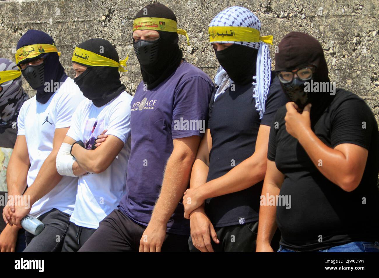 Masked Palestinian protesters seen during the demonstration against ...