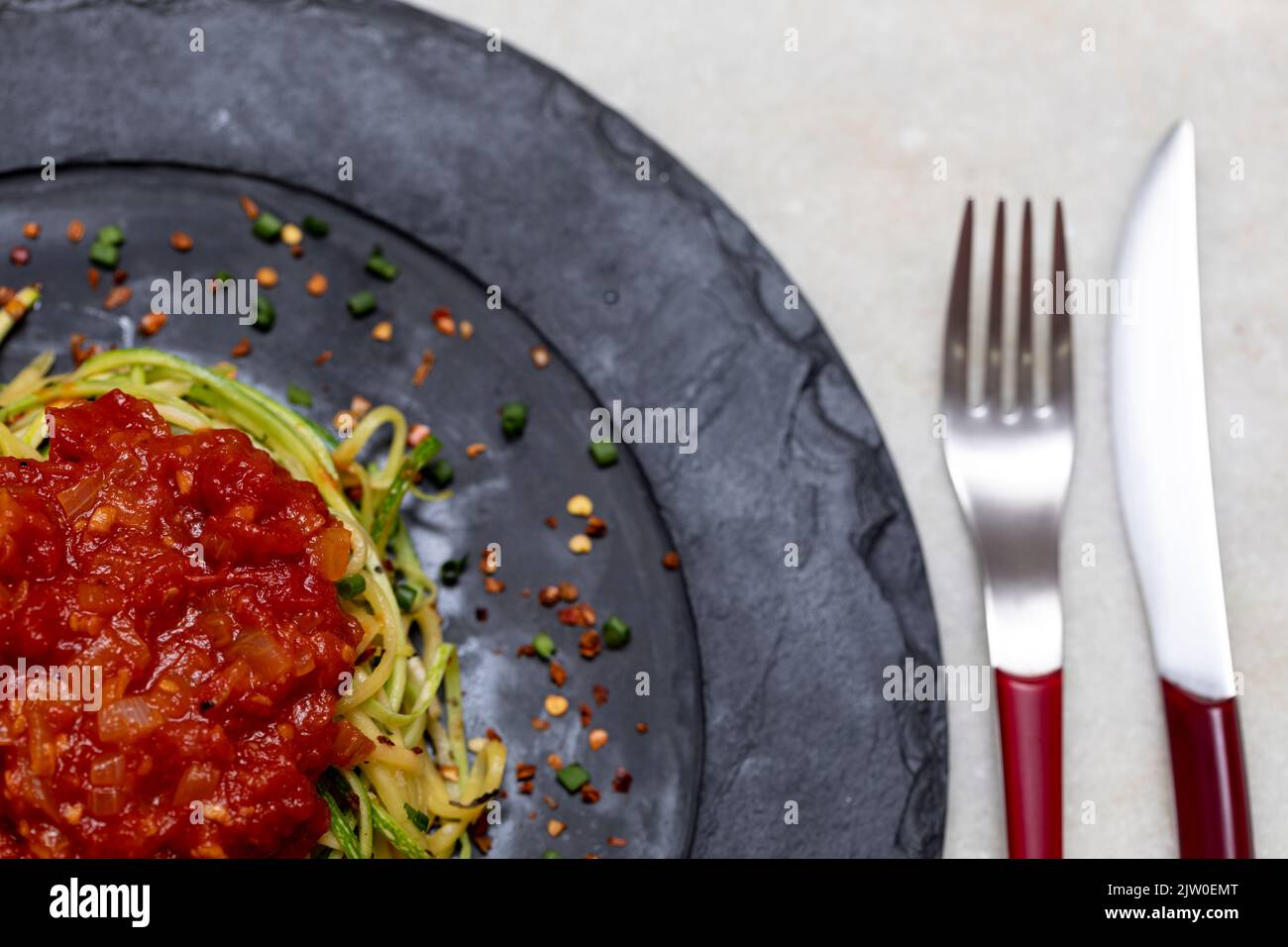 Zucchini spaghetti with dehydrated pepperoni pepper and red sauce Stock ...