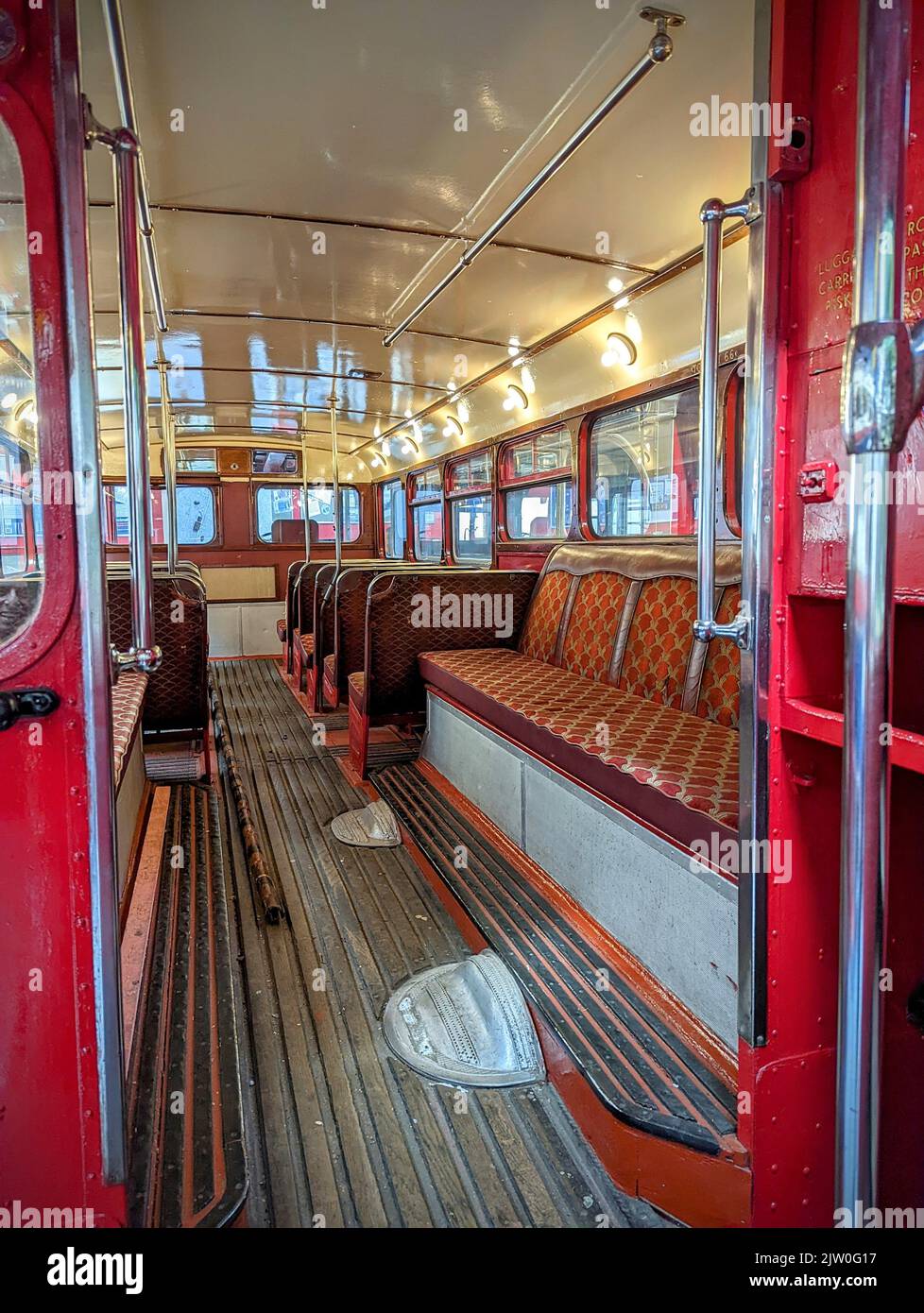 A vertical shot of an inside view tram with seats and handles Stock ...