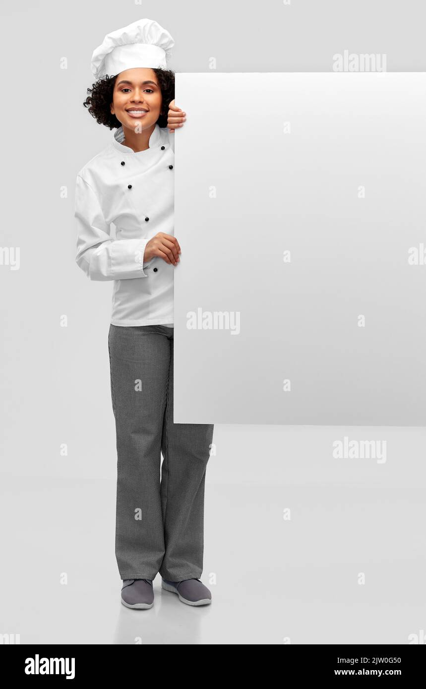 smiling female chef with white board Stock Photo - Alamy