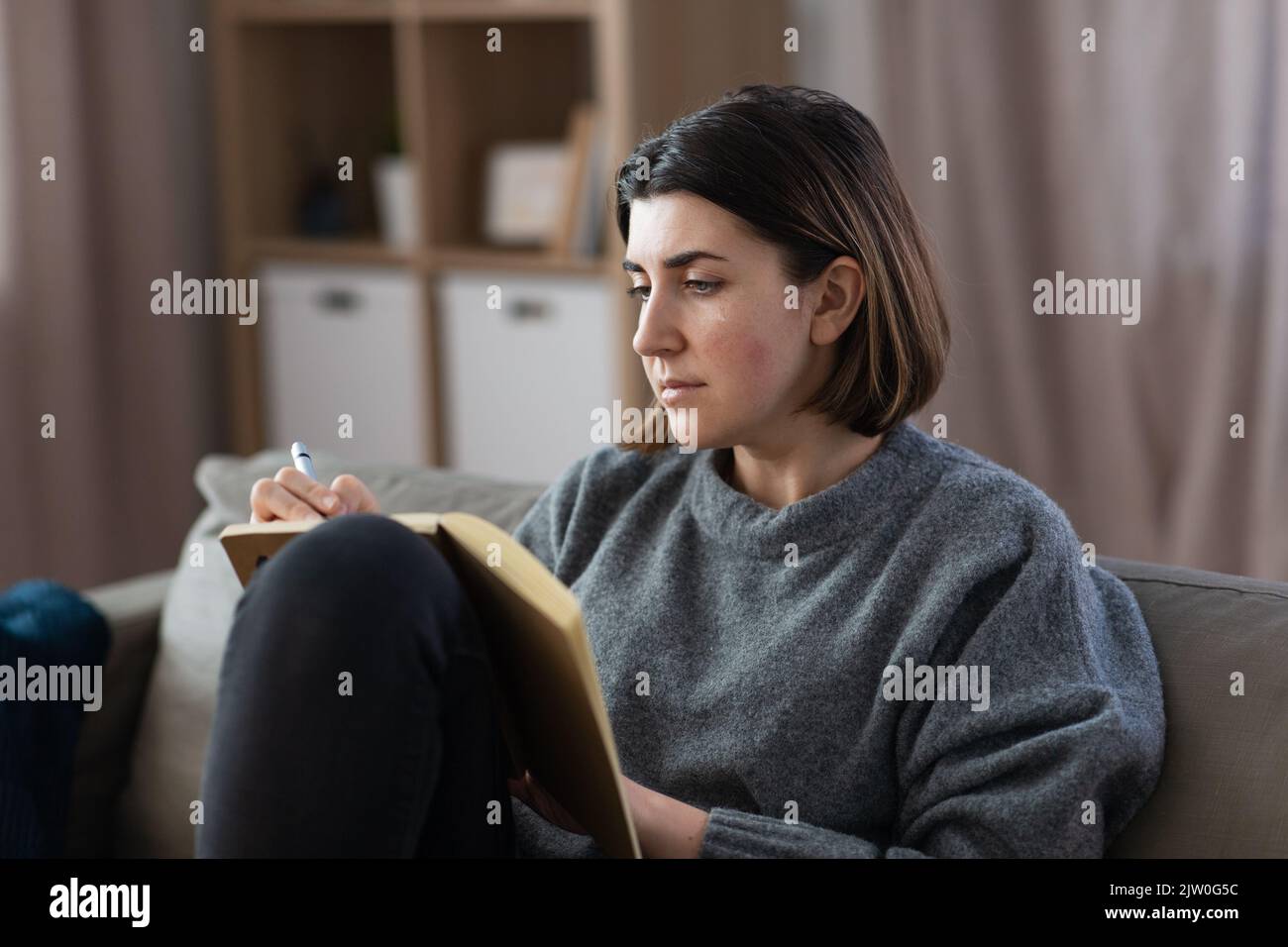 Person sad writing journal hi-res stock photography and images - Alamy