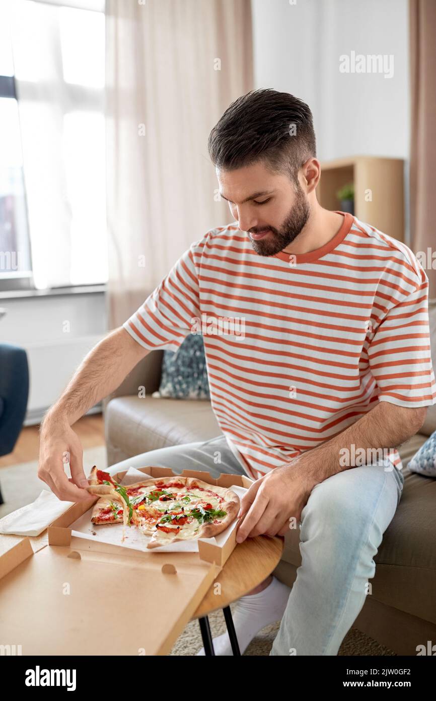 Man opening box eating takeaway hi-res stock photography and images - Alamy