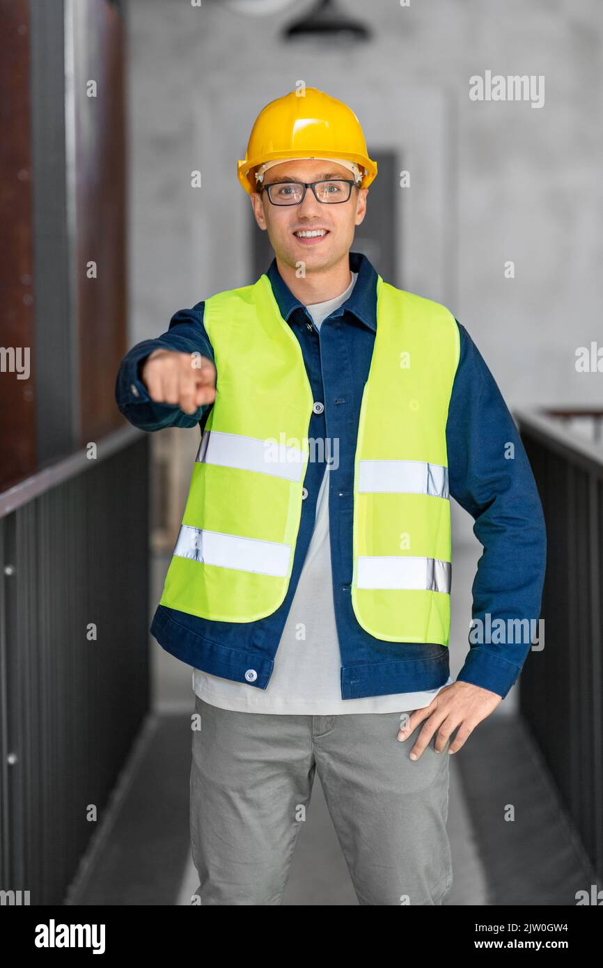 male architect in helmet and safety west at office Stock Photo - Alamy