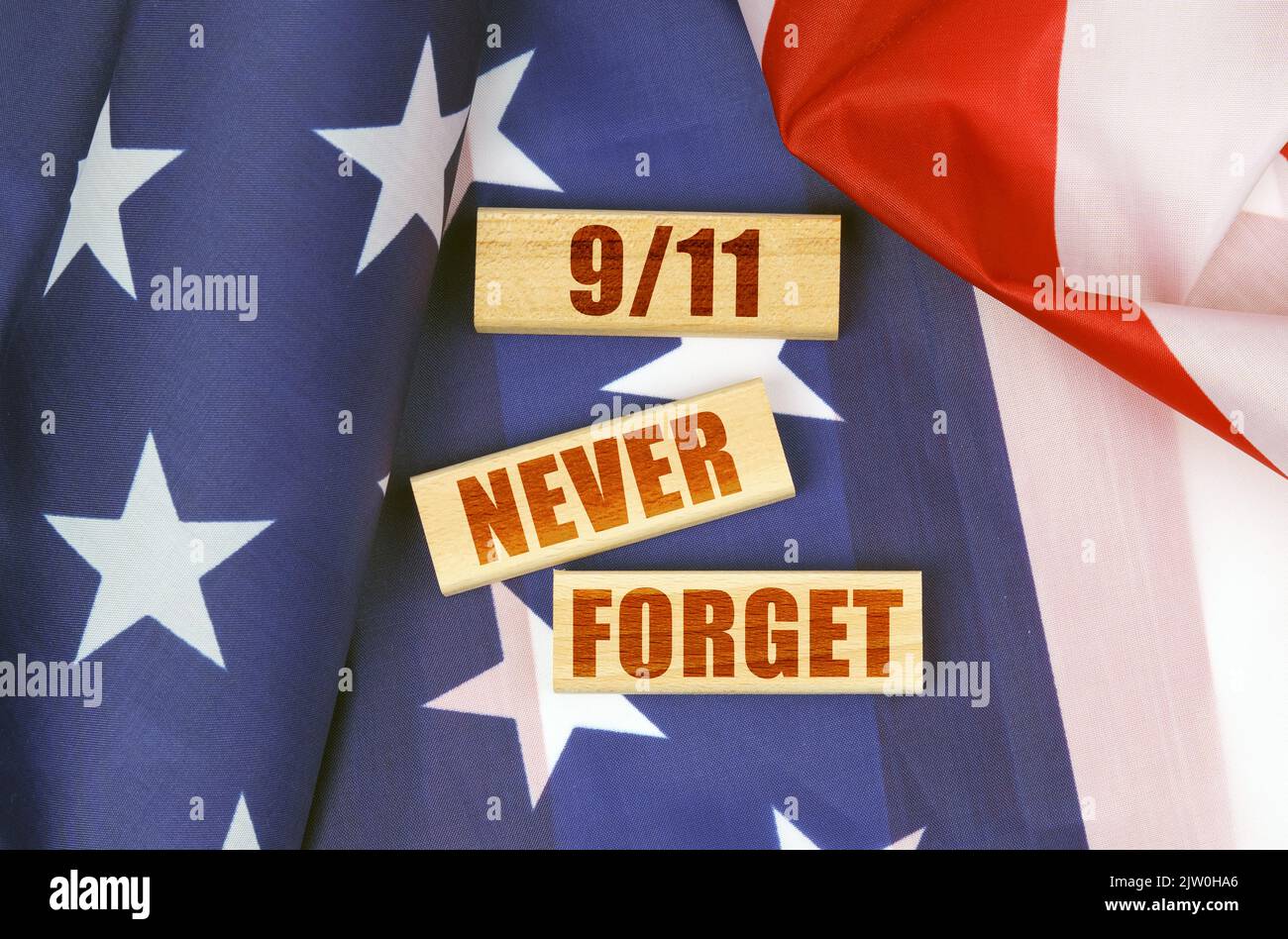 On the flag of the United States lie wooden blocks with the inscription ...