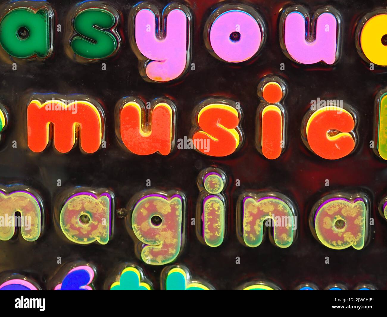 Colorful Words Against a Black Background Stock Photo - Alamy