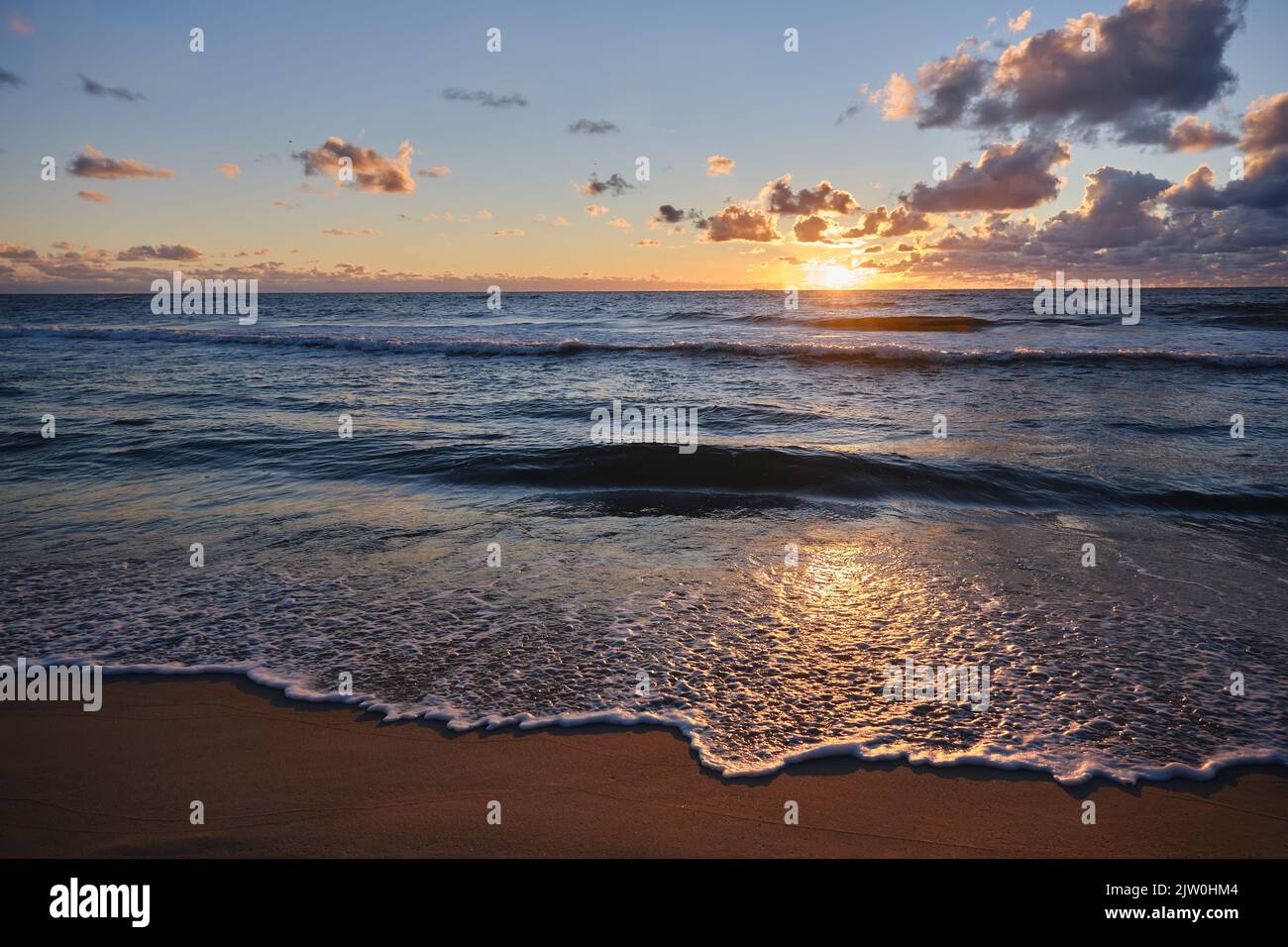 Dramatic summer sunset sky and tropical sea at dusk. Beach sand, sea ...