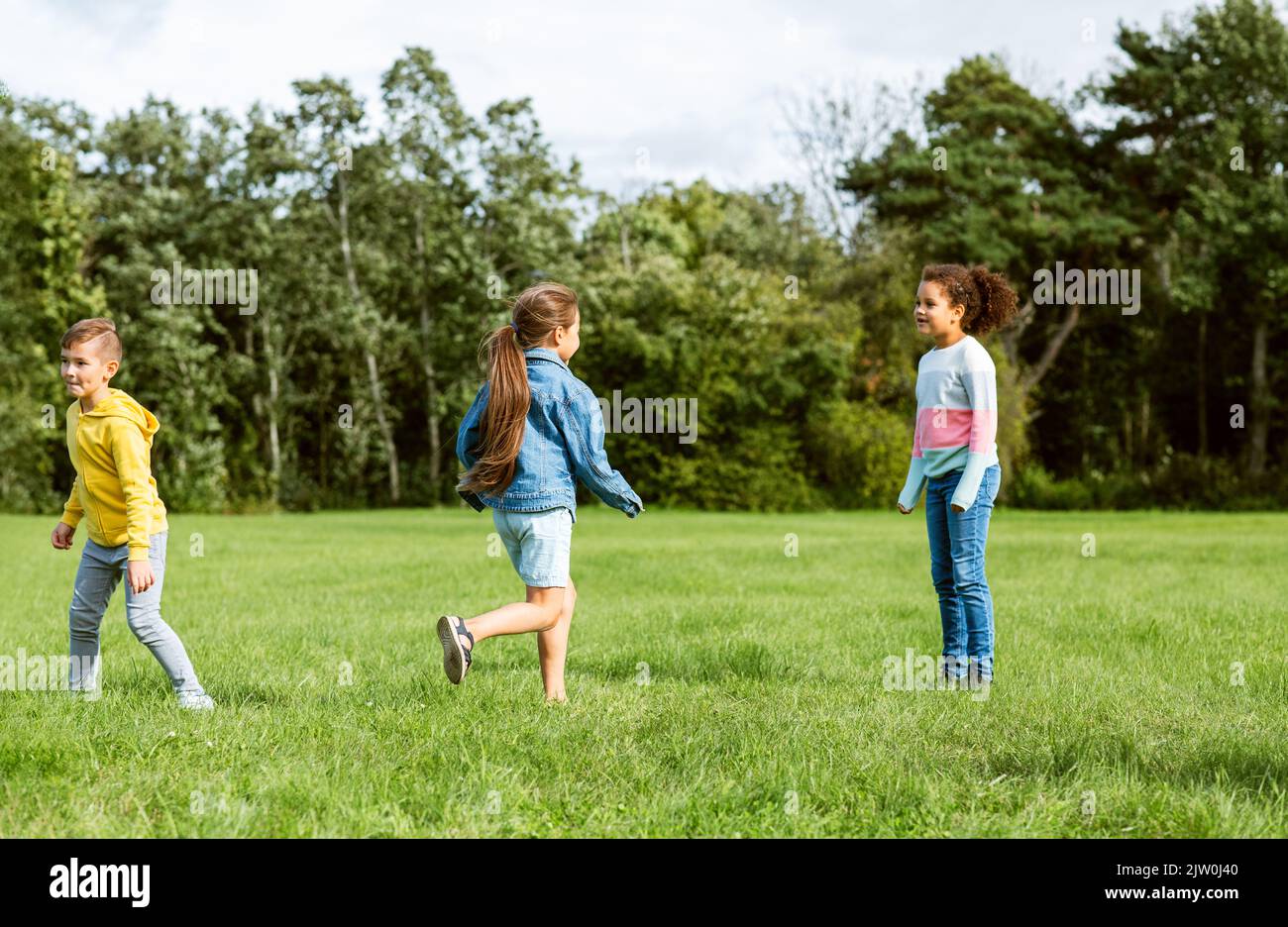 happy children playing and running at park Stock Photo - Alamy
