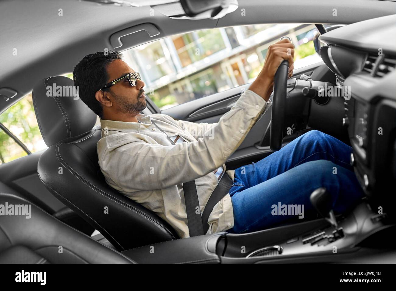 Indian man driving car in hi-res stock photography and images - Alamy
