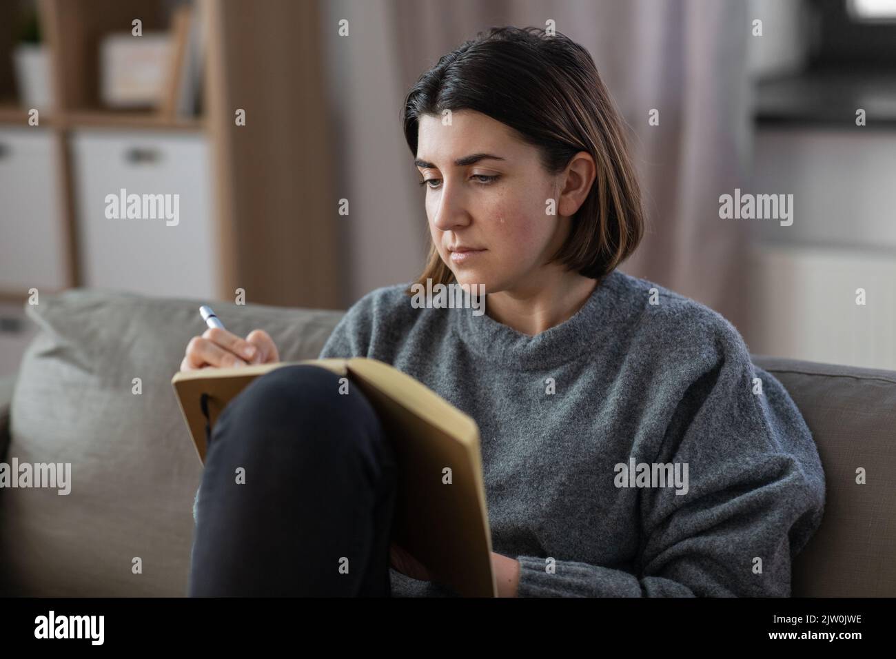Person sad writing journal hi-res stock photography and images - Alamy