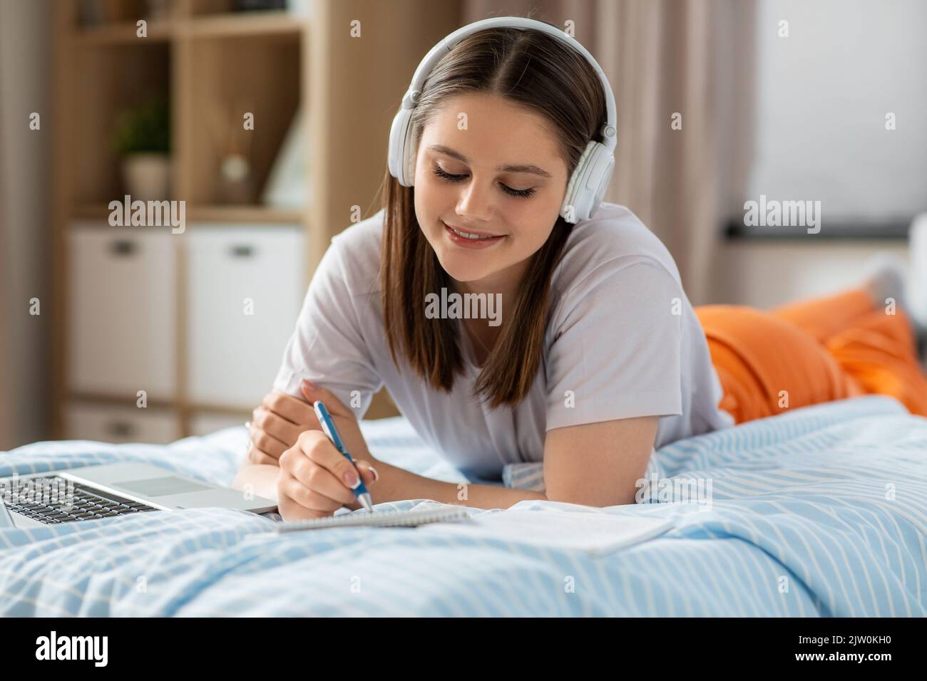 happy student girl in headphones learning at home Stock Photo - Alamy