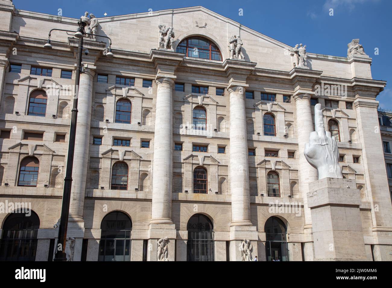 L.O.V.E. Sculpture by Maurizio Cattelan in front of the Milan stock ...