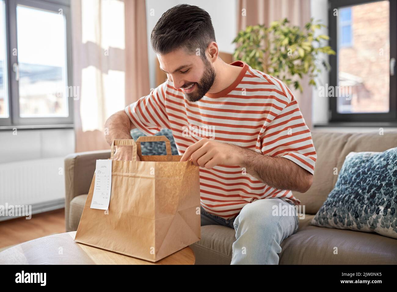 Man food takeaway bag hi-res stock photography and images - Alamy