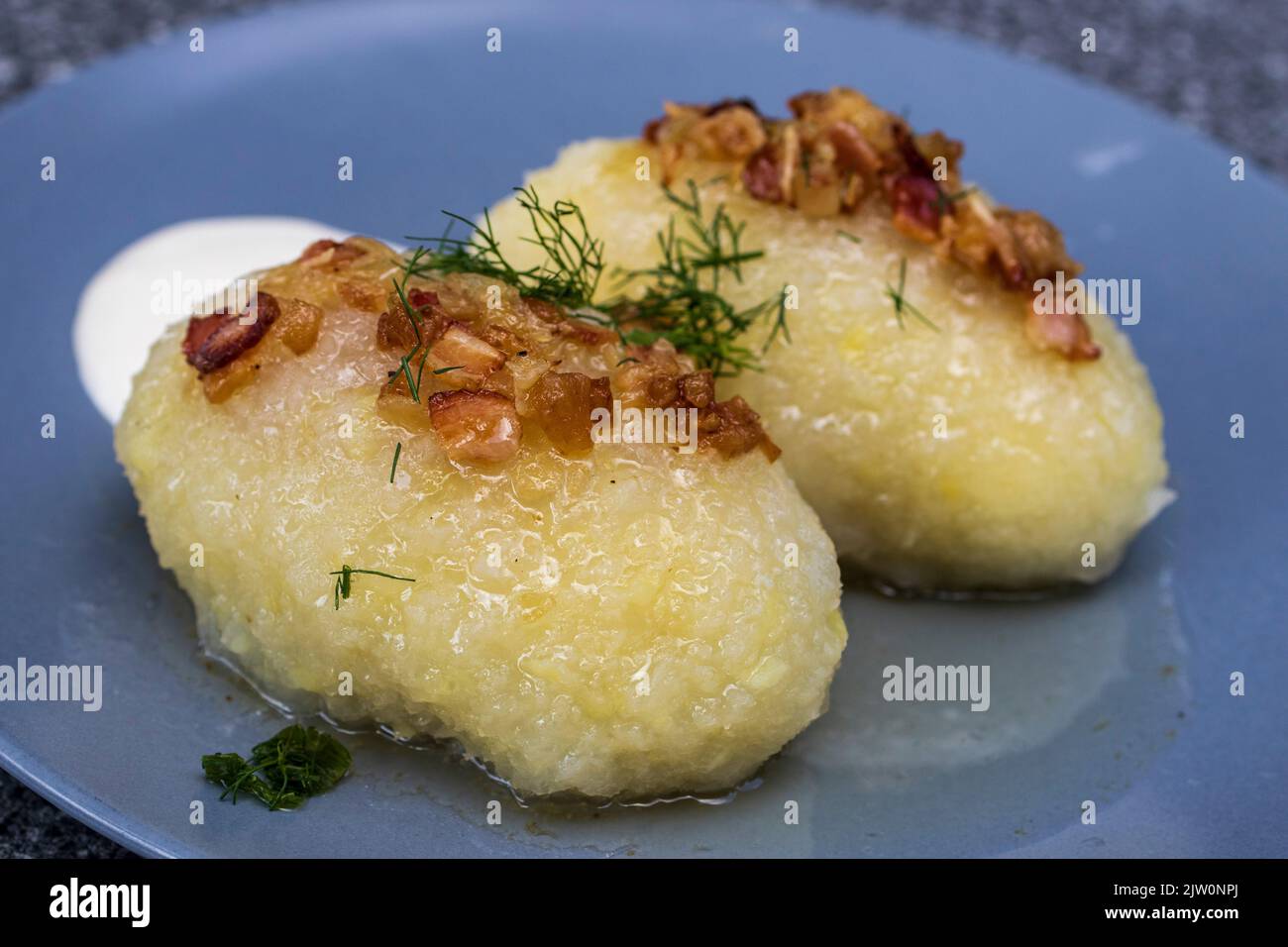 Two Cepelinai or didzkukuliai on a plate, national dish of Lithuania ...