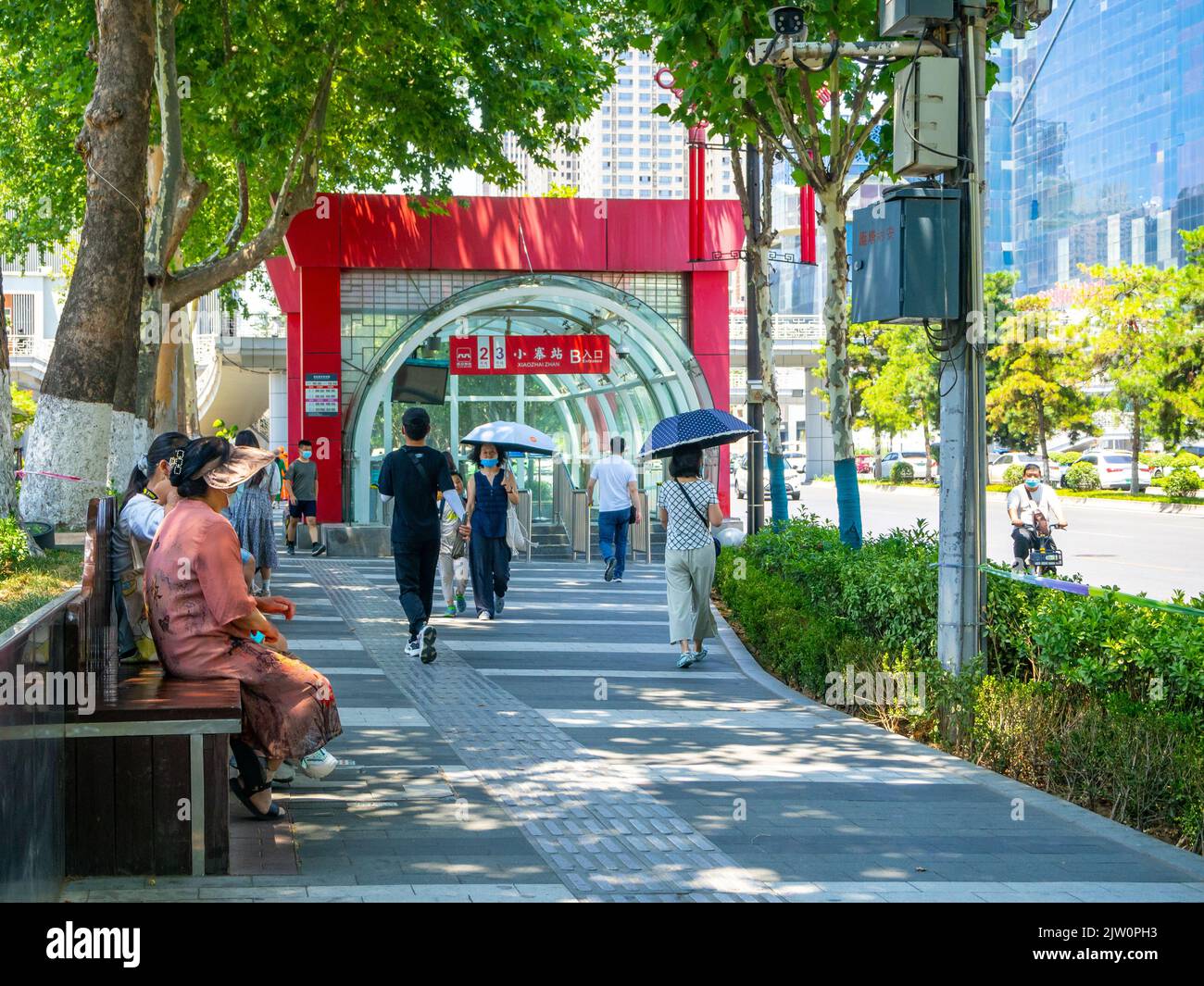 Chinese people enter a station of the Xi'an Rail Transit or Xian Metro ...