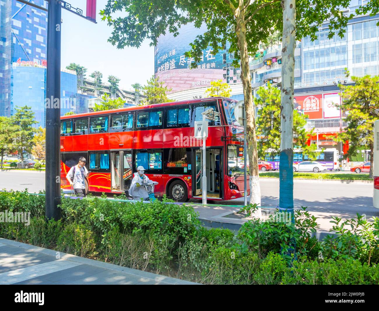 A tourist double-decker bus is waiting for passengers in the downtown ...