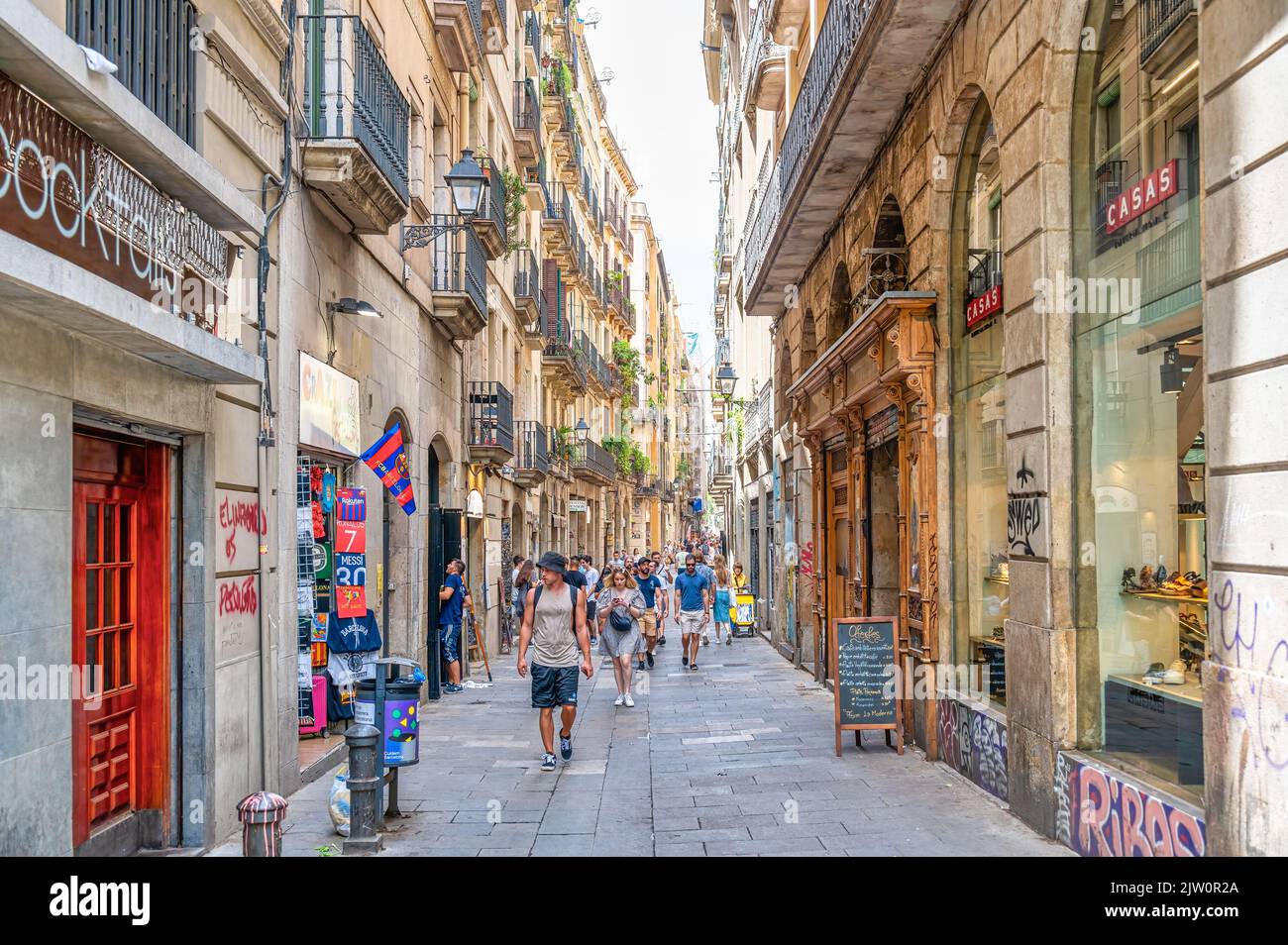 People walking in a narrow street or colonial style alleyway in the ...