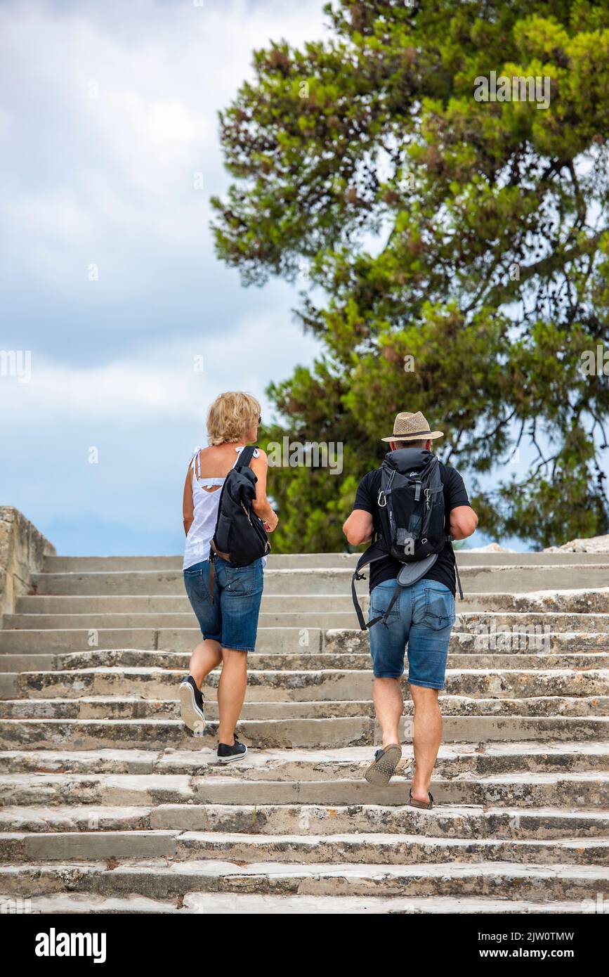 man and woman exploring the ancient minoan greek remains and ruins at ...