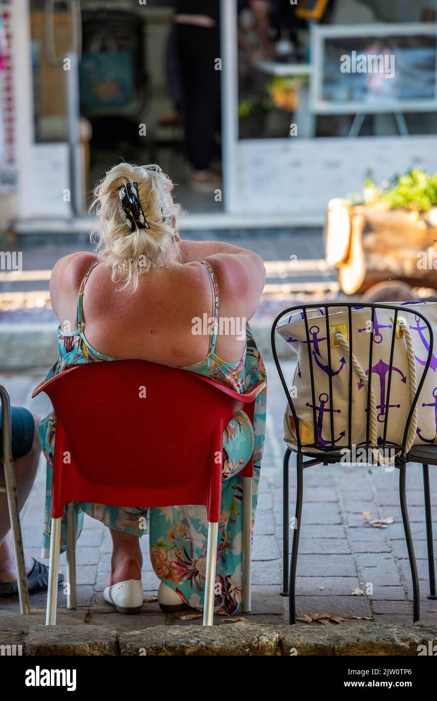 woman sitting with her back to camer, large woman, fat woman, obesity ...