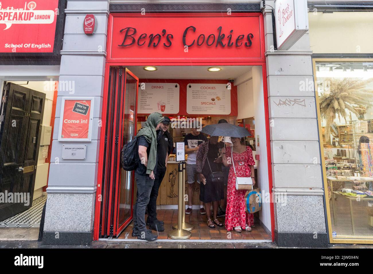 Amber rain catches Londoners this afternoon at Oxford Street. Image ...
