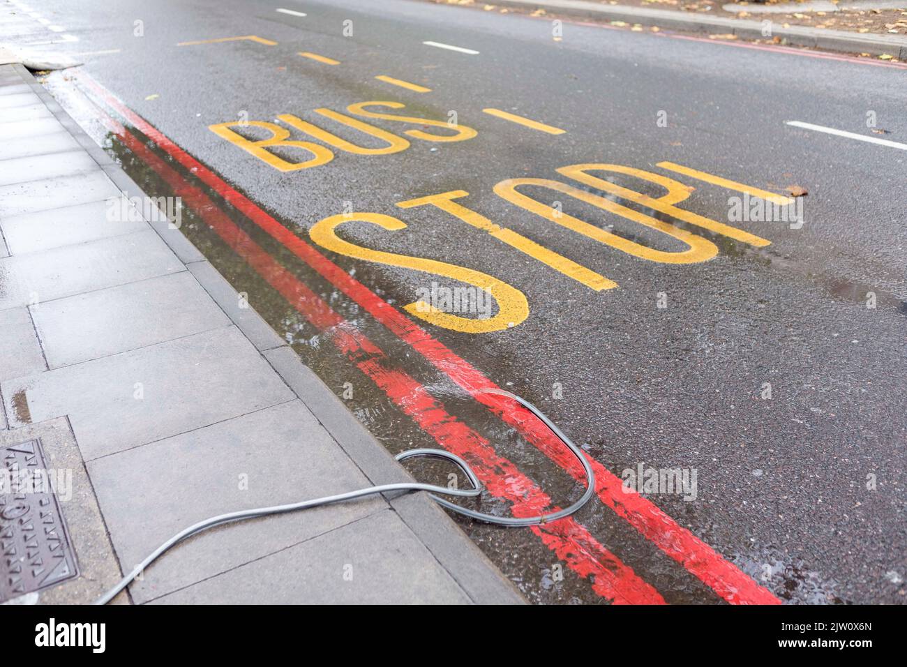 Workers clean up a flash flood near Euston following heavy amber rain ...