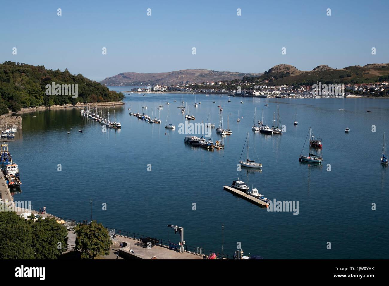 Conwy Quayside and Harbour in North Wales with boats at anchor on a ...