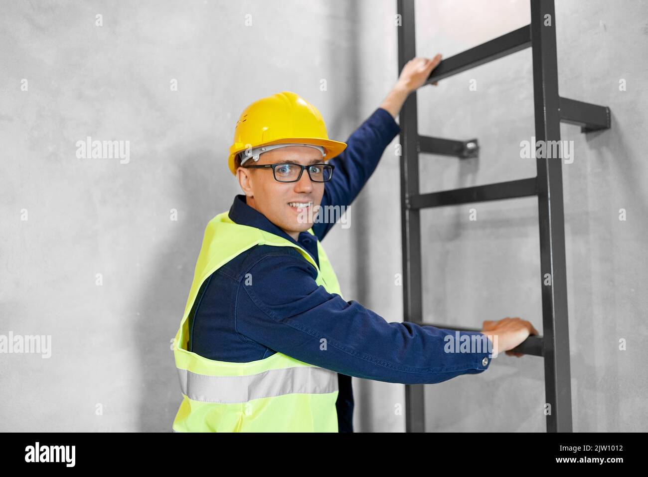 Construction worker climbing ladder hi-res stock photography and images ...