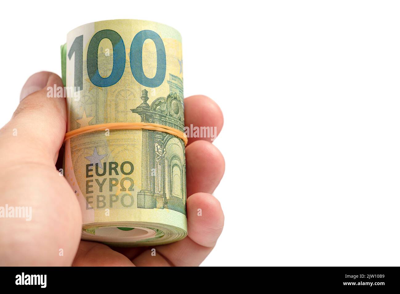 Money in hand isolate on white. The hand holds a roll of 100 euro ...