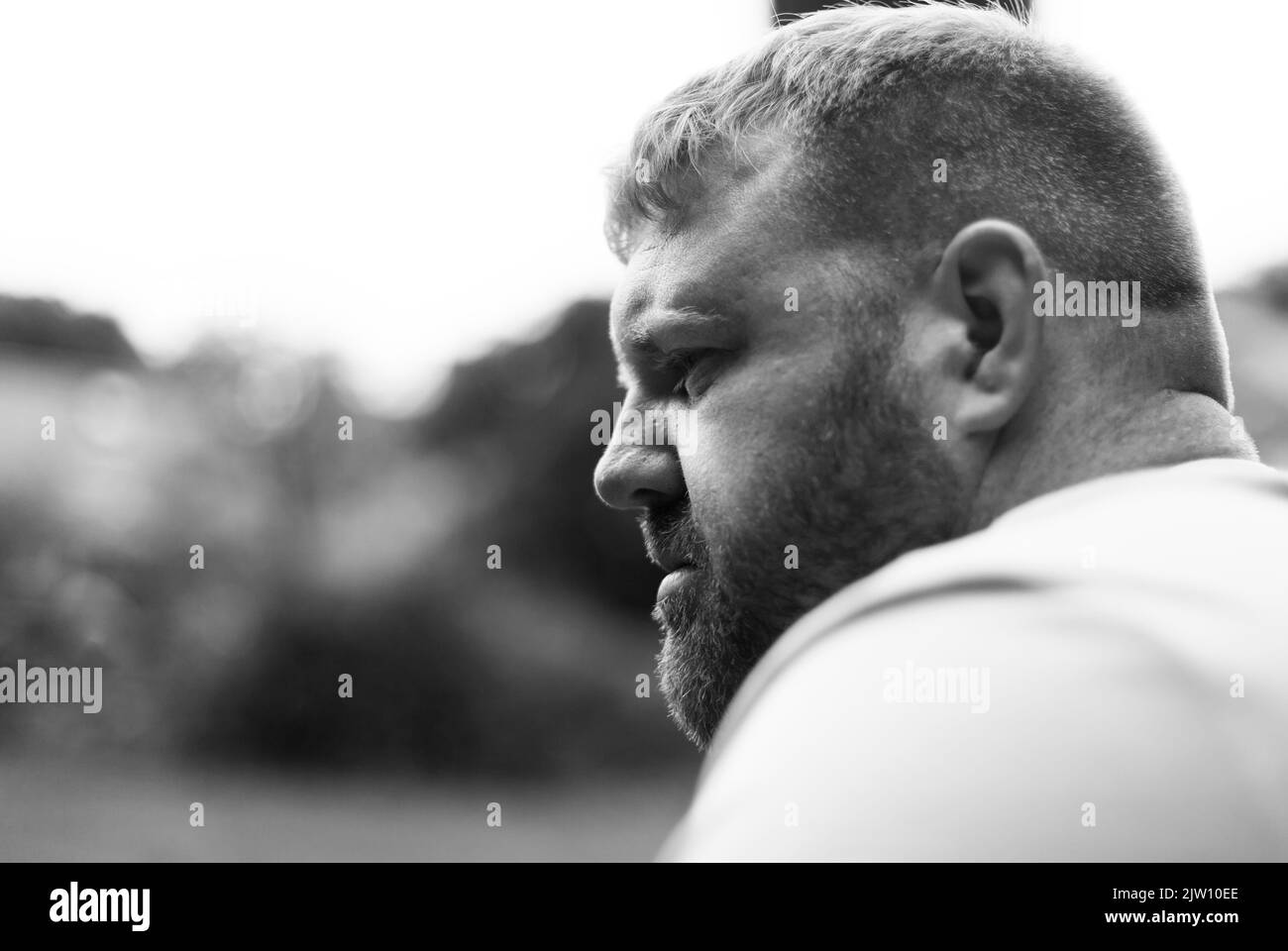 Side headshot of a Caucasian male with a solid straight looking stare ...