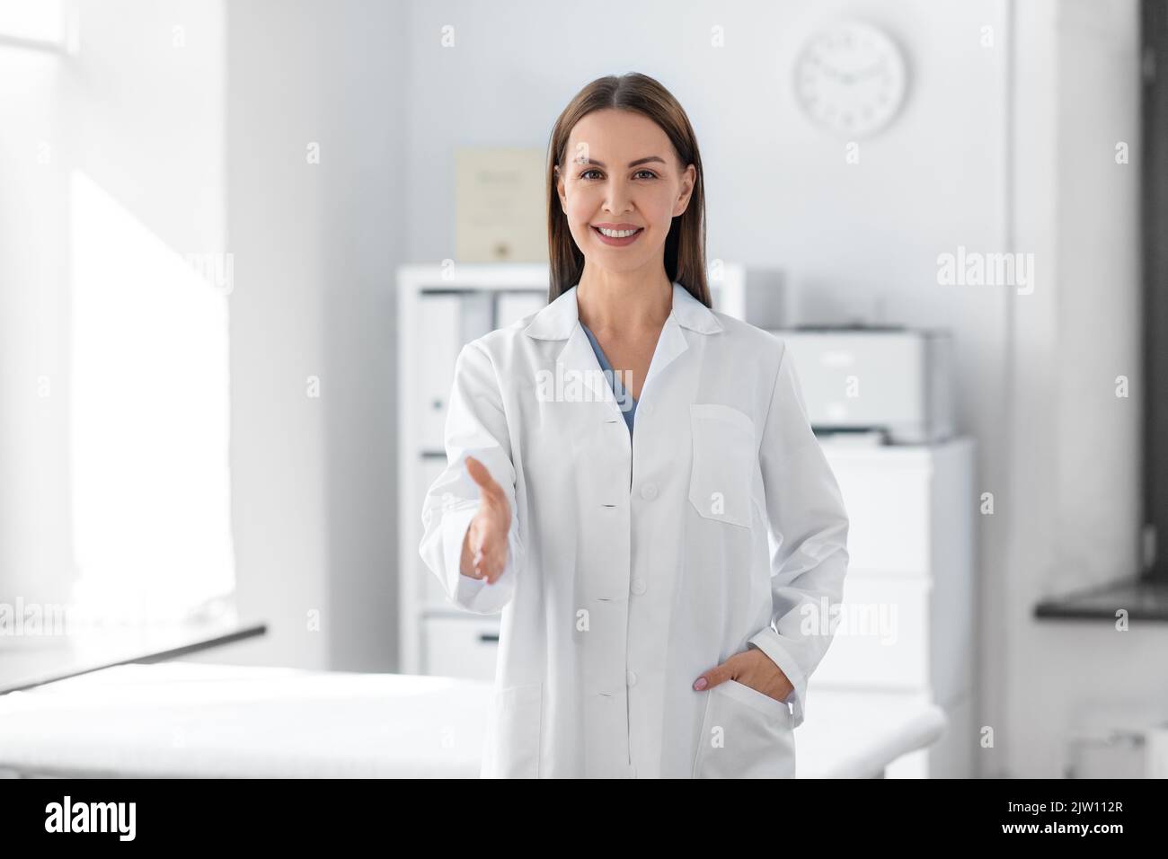 female doctor giving hand for handshake at clinic Stock Photo - Alamy