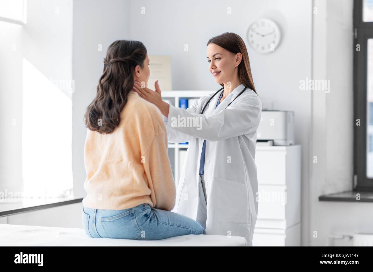 doctor checking lymph nodes of woman at hospital Stock Photo - Alamy
