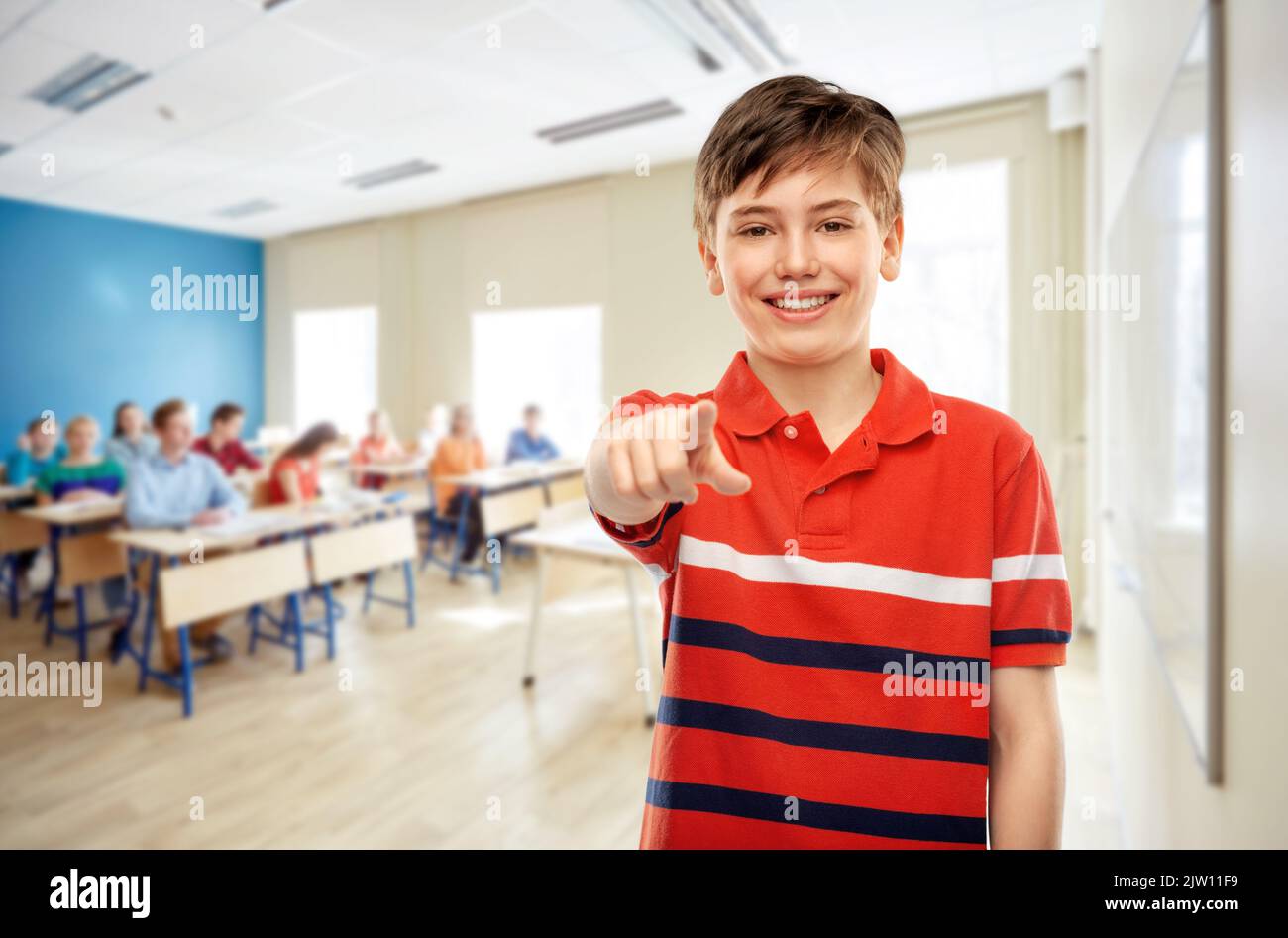 student boy pointing finger to camera at school Stock Photo - Alamy