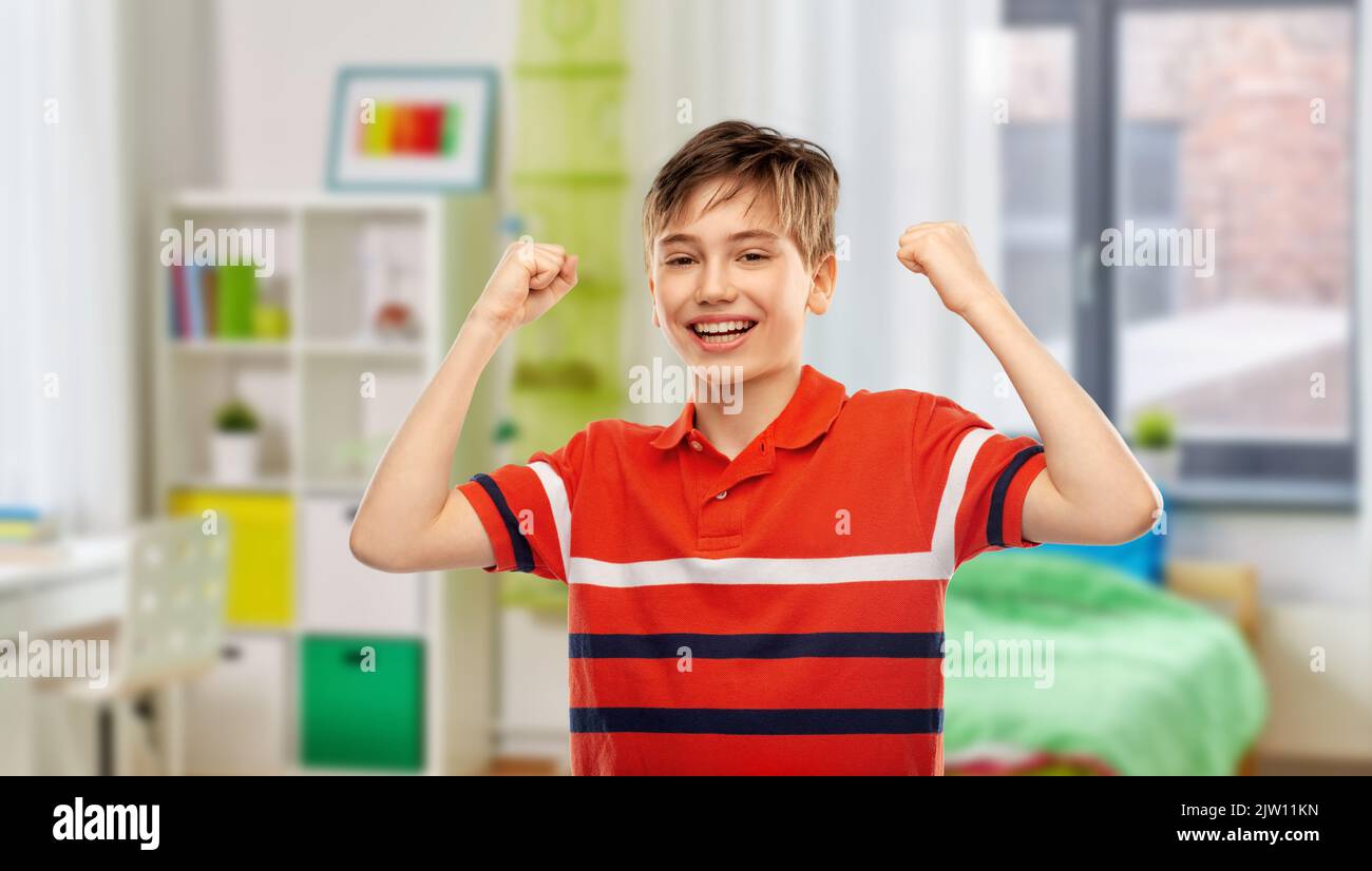 portrait of happy smiling boy celebrating success Stock Photo - Alamy