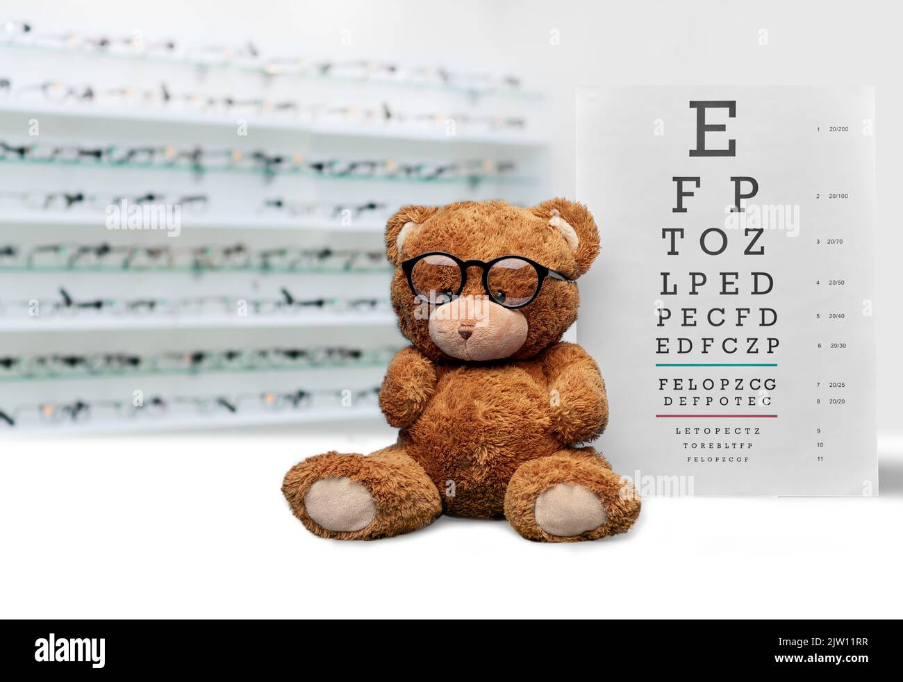 teddy bear in glasses with eye chart at store Stock Photo - Alamy