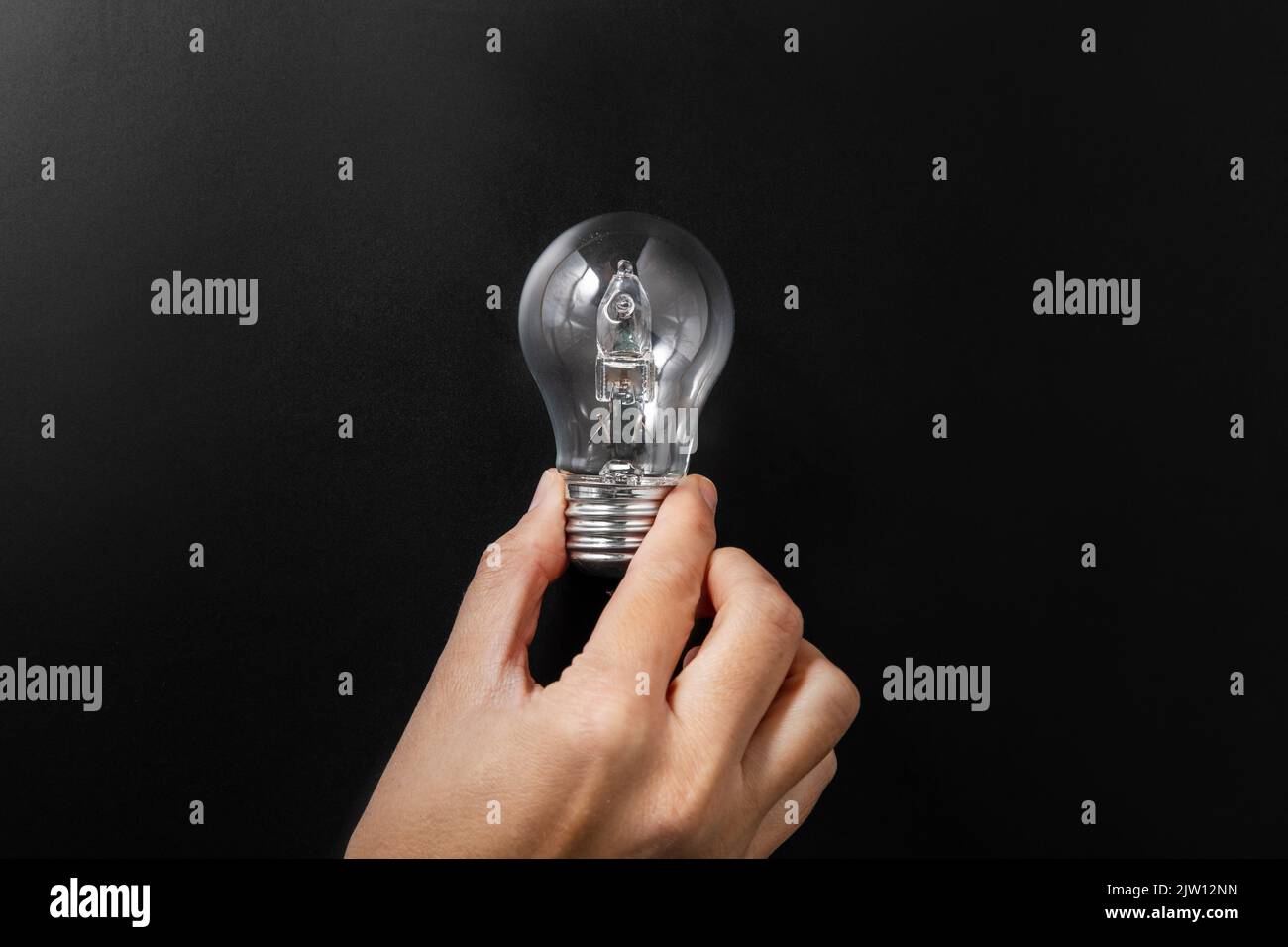 Hand holding lightbulb hi-res stock photography and images - Alamy