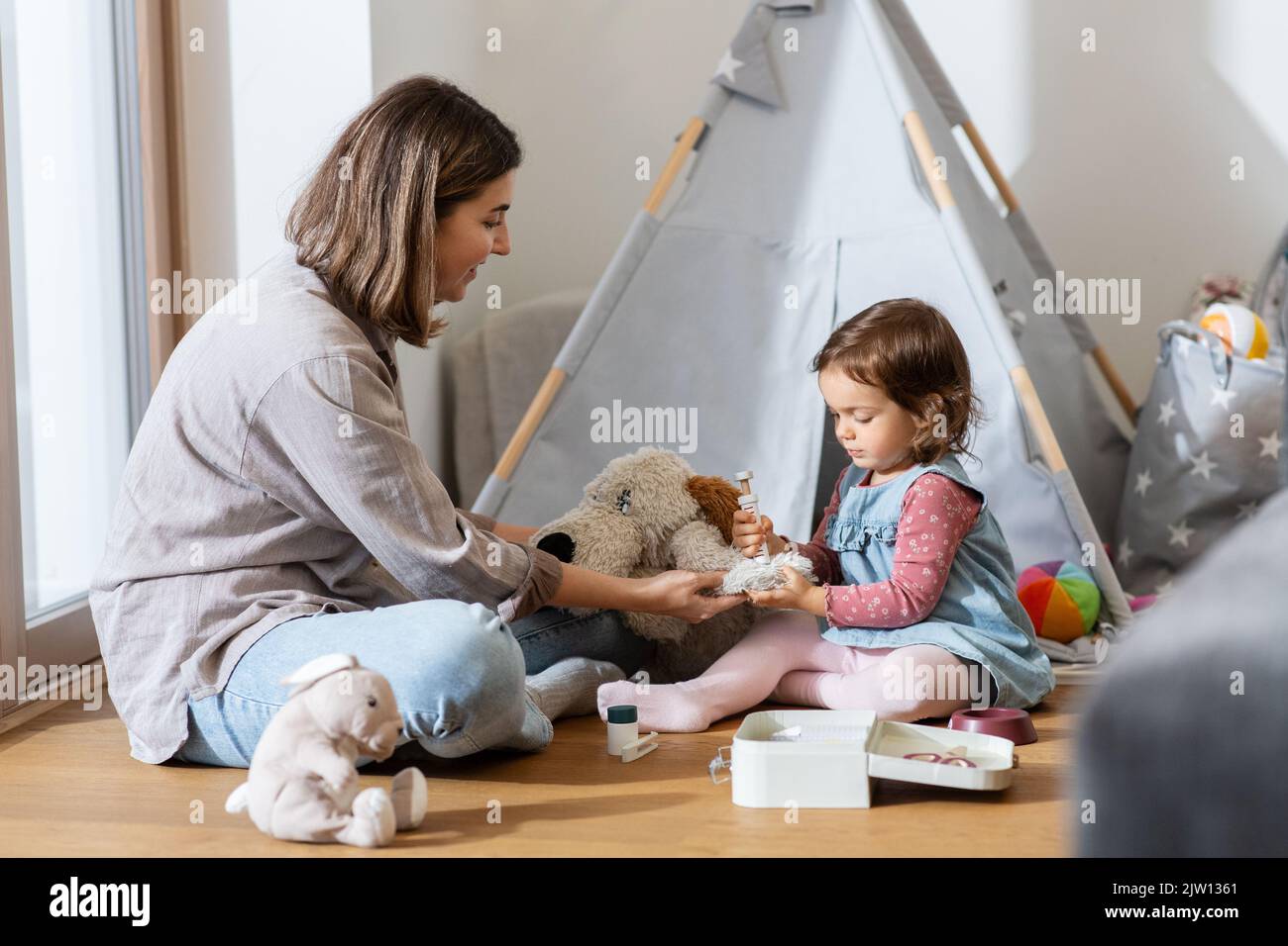 mother and daughter playing doctor at home Stock Photo - Alamy