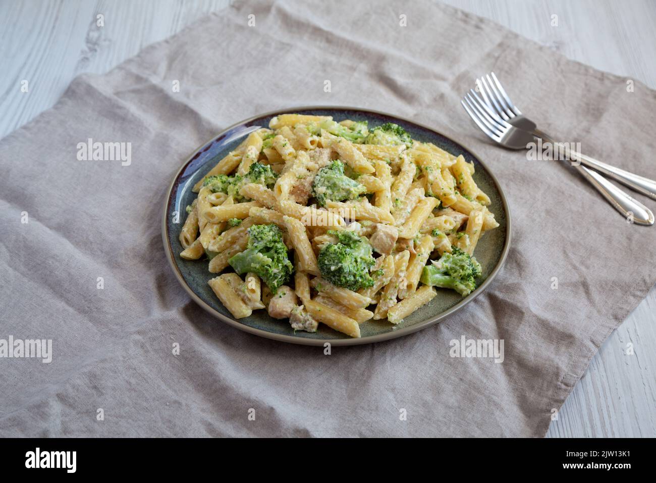 Homemade Penne Alfredo Pasta with Chicken and Broccoli on a Plate, side ...