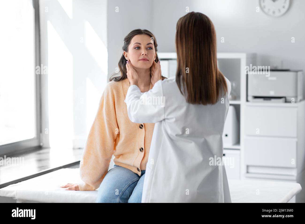 doctor checking lymph nodes of woman at hospital Stock Photo - Alamy