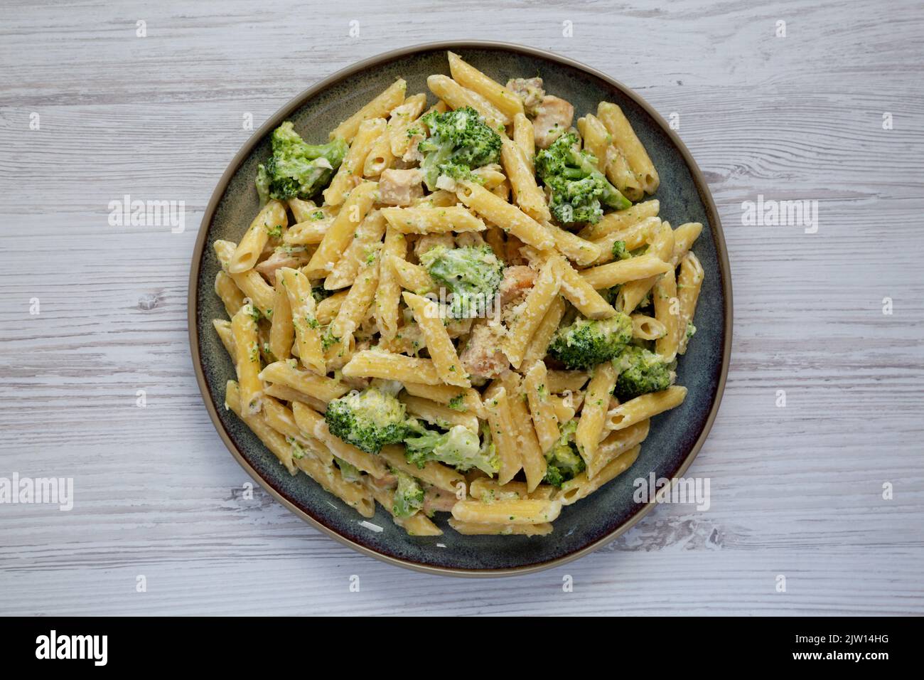Homemade Penne Alfredo Pasta with Chicken and Broccoli on a Plate, top ...