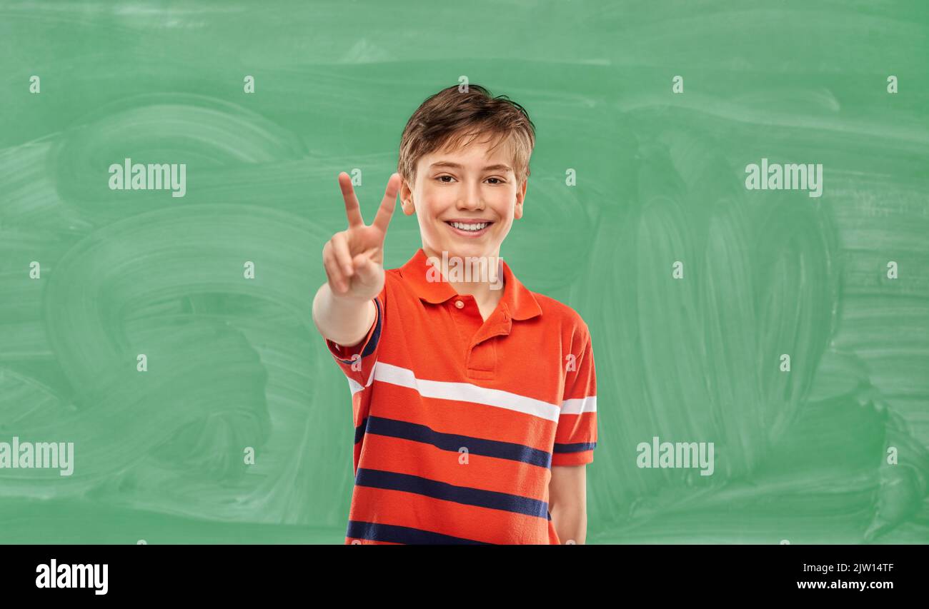 portrait of happy smiling boy in red polo t-shirt Stock Photo - Alamy