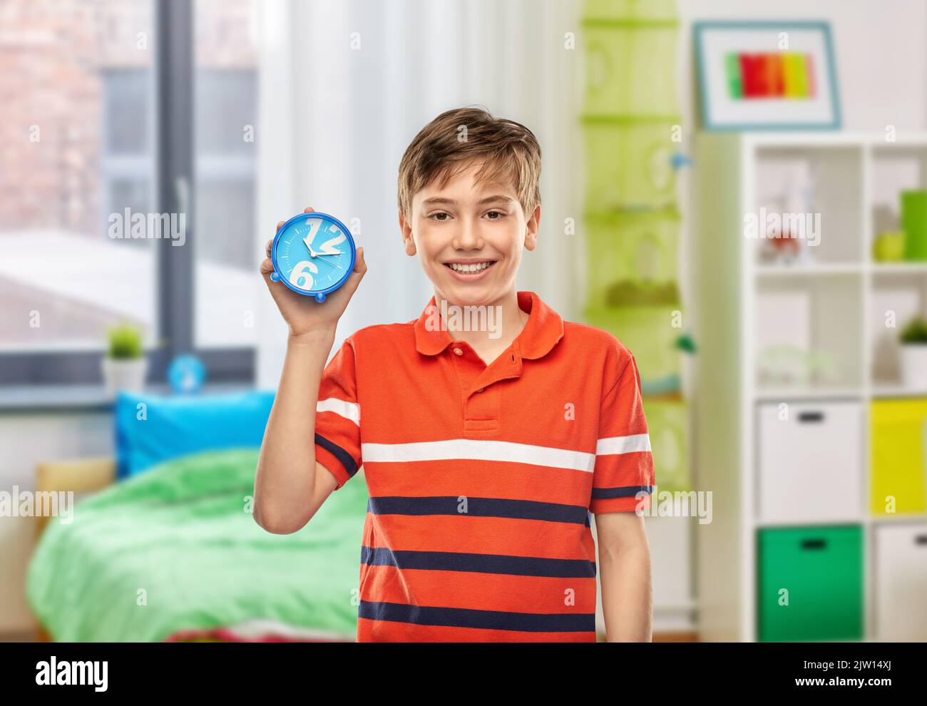 Boy showing clock hi-res stock photography and images - Alamy