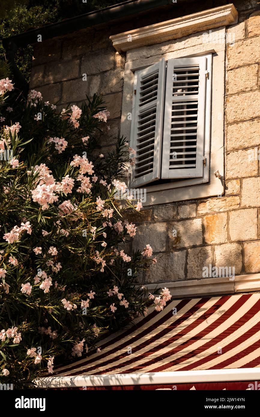 Beautiful mediterranean house with white window shutters and red and ...