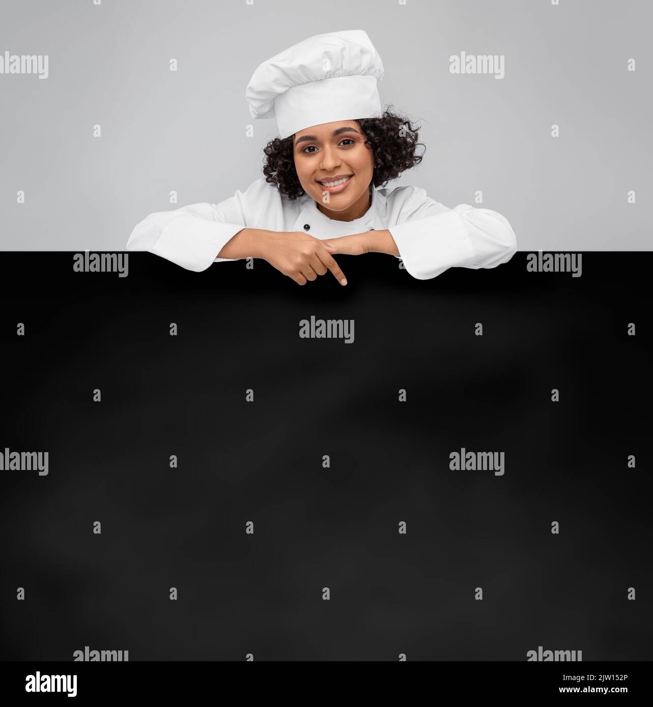 smiling female chef with white board Stock Photo - Alamy