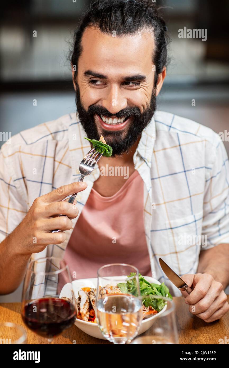 Hispanic man eating hi-res stock photography and images - Alamy